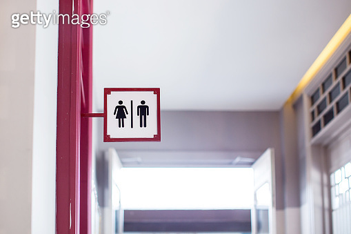 Restroom sign Hanging on the ceiling in the department store ...