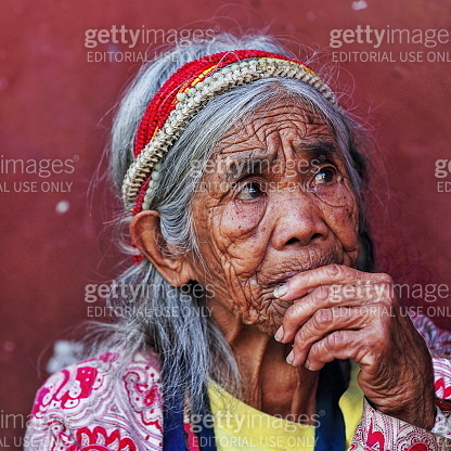 Old Igorot woman wearing a snake bone headdress. Sagada-Mountain ...
