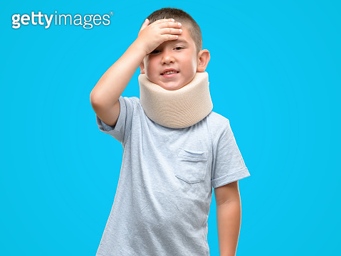 Dark haired little child injured wearing neck collar stressed with hand ...