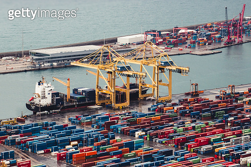 Cargo transportation ship moored at the pier and loaded with two large ...