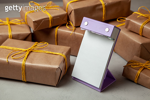 Empty tear-off calendar and many gift boxes. Calendar without date ...