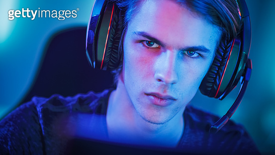 Portrait of the Young Handsome Pro Gamer Playing in Online Video Game ...