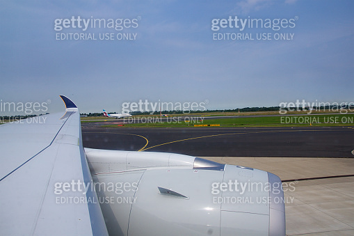 Civil jet airplane making turn on the runway, preparing for departure ...