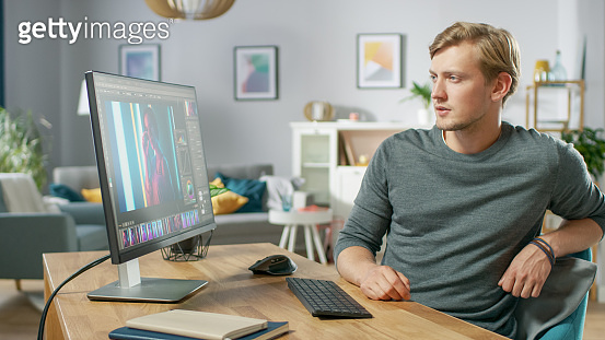 Professional Photographer Works in Photo Editing App / Software on His ...