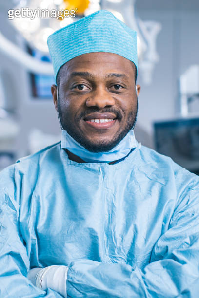 Portrait of the Professional Surgeon Takes off Surgical Mask after ...