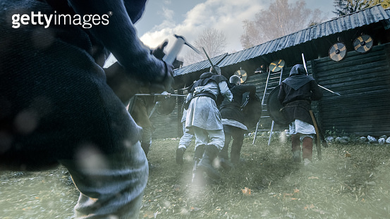 Large-Scale Medieval Battle Reenactment. Violent Tribe of Warriors Attack Wooden Fortress Wall ...