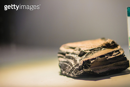 Obsidian stone specimen for education. Obsidian is a naturally ...