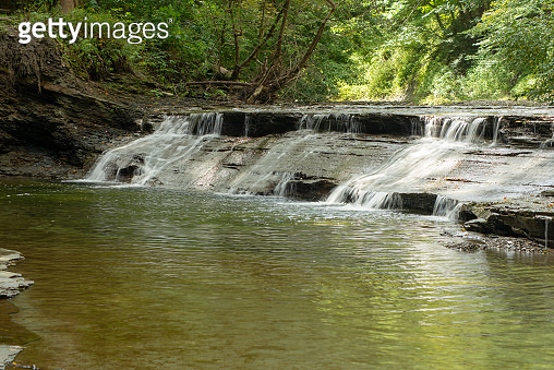 Waterfall on small creek in late summer 이미지 (1045708046) - 게티이미지뱅크