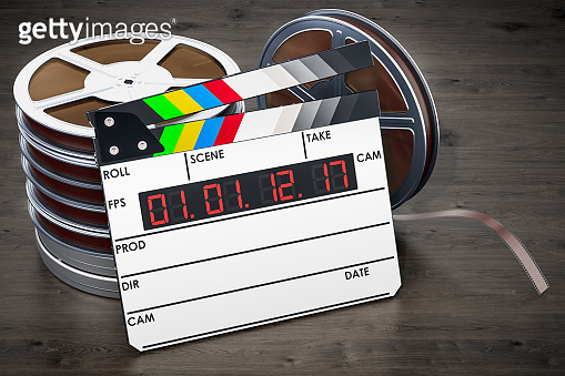 Cinema concept. Digital movie clapper board with film reels, 3D ...