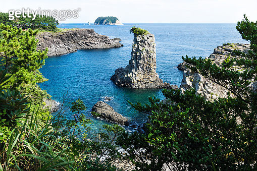 Rock formation Oedolgae in the ocean with Moon Island in the background ...