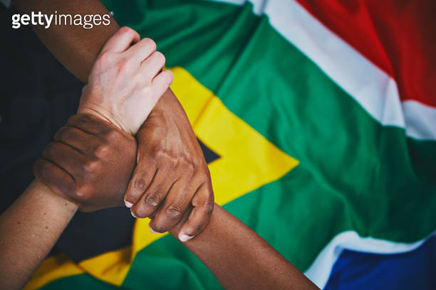 Three hands clasped in unity over South African flag 이미지 (912885866 ...