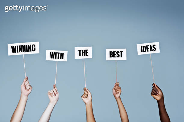 Hands hold aloft sign" winning with the best ideas" 이미지 (958687342 ...