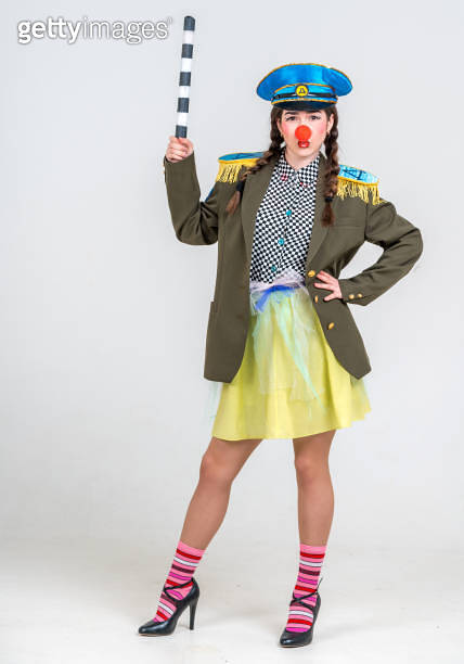Policewoman Clown with Traffic Police Stick (952402132) - 게티이미지뱅크