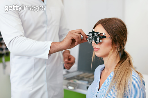 Eye Exam. Woman In Glasses Checking Eyesight At Clinic (1064562948 ...