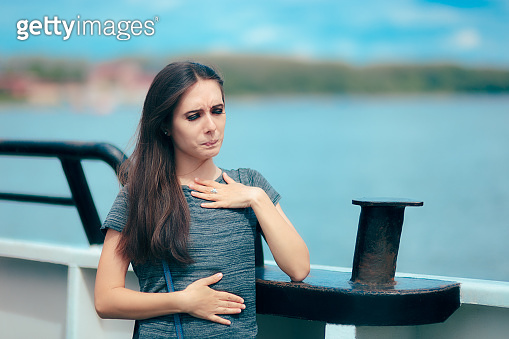 Sea sick woman suffering motion sickness while on boat (911945294) - 게티 ...