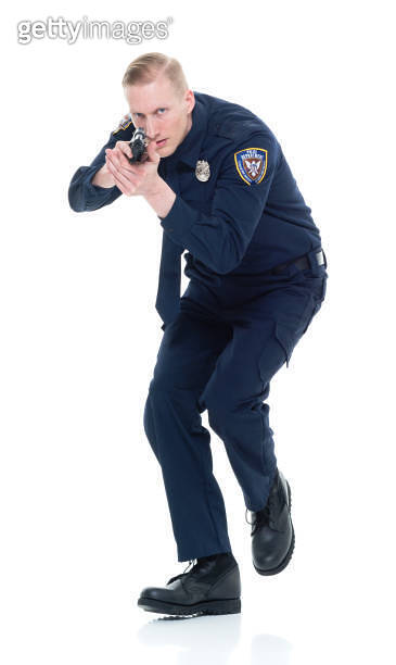 Handsome and friendly police officer sneaking around with gun 이미지 ...