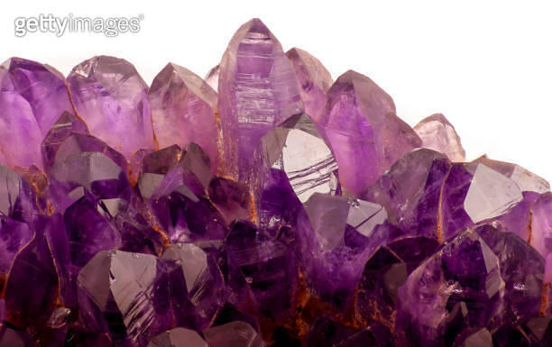 Purple color amethyst crystals macro shot isolated on white background ...
