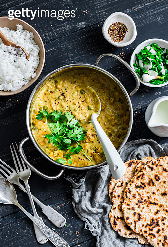 Indian dhal in cooking pan with jasmine rice, coriander and whole grain ...