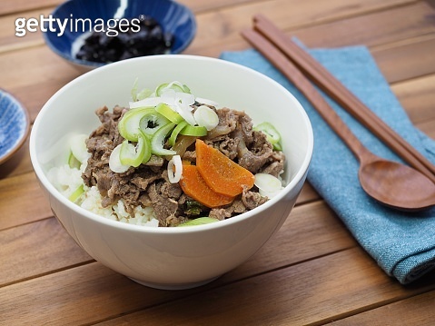 Asian food Bulgogi with Rice, A bowl of rice topped with bulgogi ...