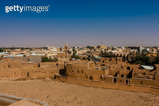 An aerial view of the mud brick suburbs from the Munikh Castle, Al ...