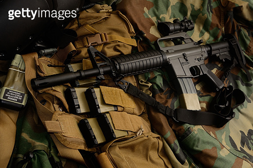 Assault rifle carbine with tactical chest rigs. Military Equipment ...