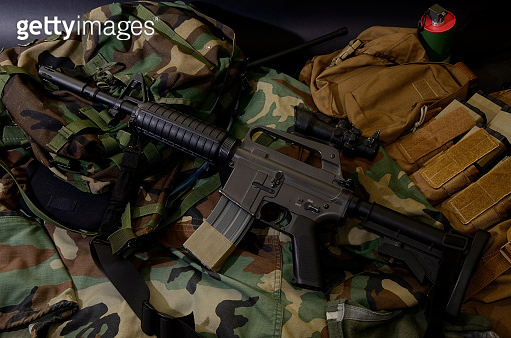 Assault rifle carbine with tactical chest rigs. Military Equipment ...