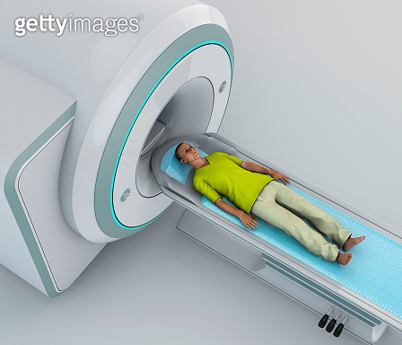 CT scan, computed tomography scan. Young patient lying down ready for a ...