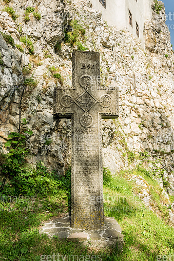Mysterious ancient stone cross with runic symbols. Landmarks of Bran ...