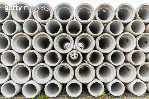 Stack of concrete sewer pipes at factory 이미지 (968903306) - 게티이미지뱅크