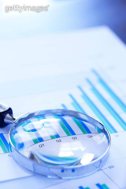 Magnifying Glass On Top Of Bar Chart Showing Positive Performance 이미지 ...