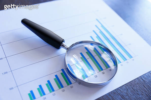 Magnifying Glass On Top Of Bar Chart Showing Positive Performance 이미지 ...