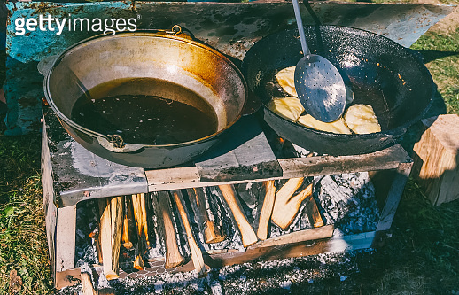Caucasian haluz dish with meat and cheese is prepared in a frying pan ...