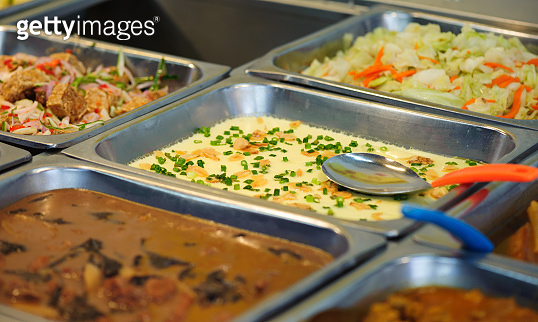 Steel tray filled with food inside the self service Chinese restaurant ...