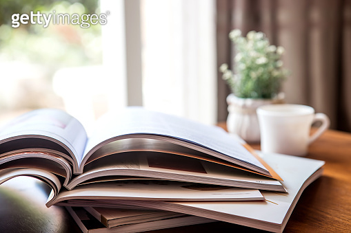 selective focus of stacking magazine place on table in living room ...
