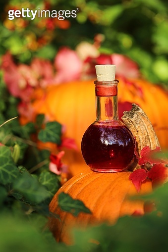 Potion for Halloween. Magic Potion.Autumn mood.Red tincture in a bottle ...