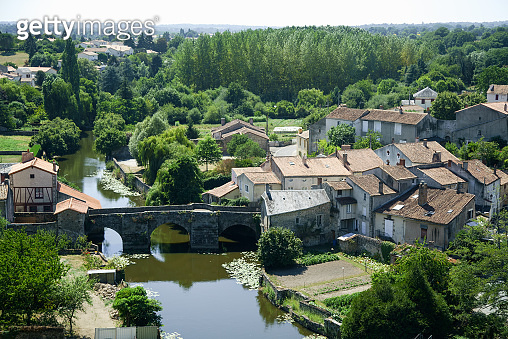 French countryside summer landscape with tile roofs and flourishing ...