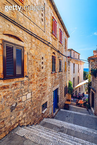 Beautiful street with flowers in the Hvar town, Hvar island, Dalmatia ...