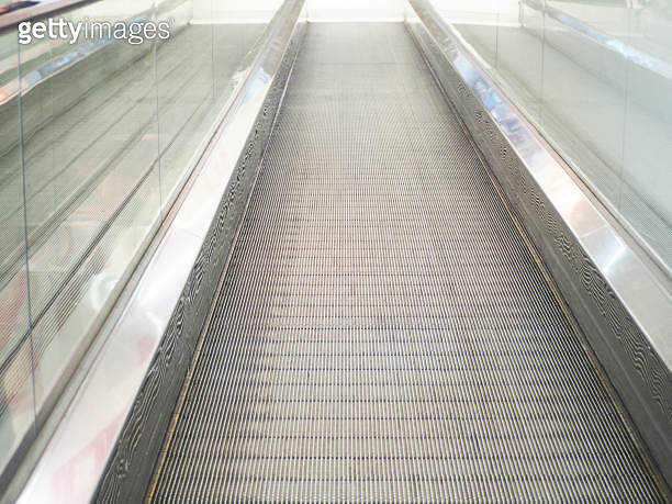 Automatic walkway, flat escalator for passenger. Travellator ...