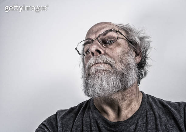 Grubby Bizarre Senior Man Staring at Camera (938930988) - 게티이미지뱅크