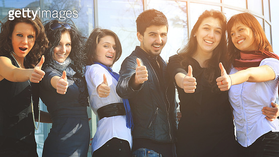 group of college students smiling friendly standing next to each other ...