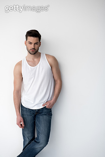Gorgeous young man is posing seriously 이미지 (958569970) - 게티이미지뱅크