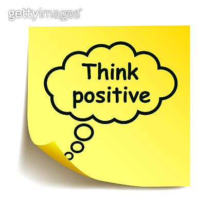 Yellow sticker with black postit „Think positive“, note hand written ...
