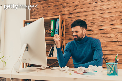 Angry sad man trying to find way to solve difficult task (973796112 ...