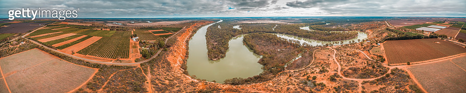Wide aerial panorama of agricultural fields and winding iconic Murray ...