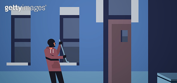burglar in black mask using crowbar breaking entering into home ...