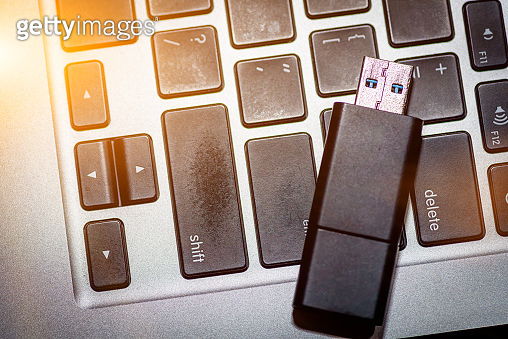 USB flash memory drive plugged into a computer laptop port. (1000579384 ...