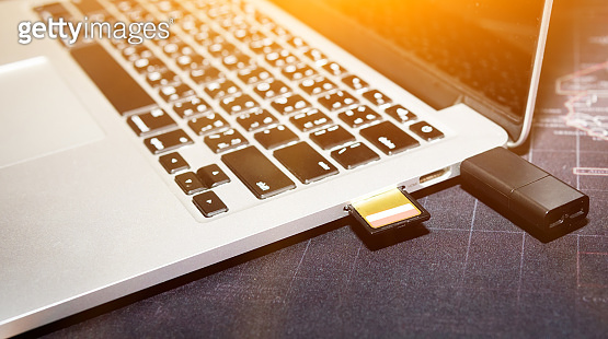 USB flash memory drive plugged into a computer laptop port. (1010535220 ...