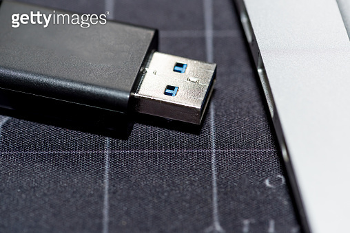 USB flash memory drive plugged into a computer laptop port. (1029866996 ...