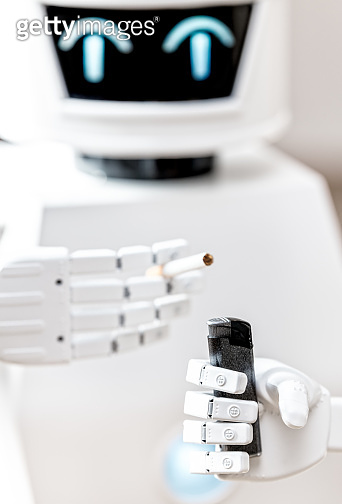 closeup of a robot with cigarette, another is giving him light, concept ...