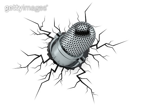 Radio microphone inside cracked hole 이미지 (1051438338) - 게티이미지뱅크